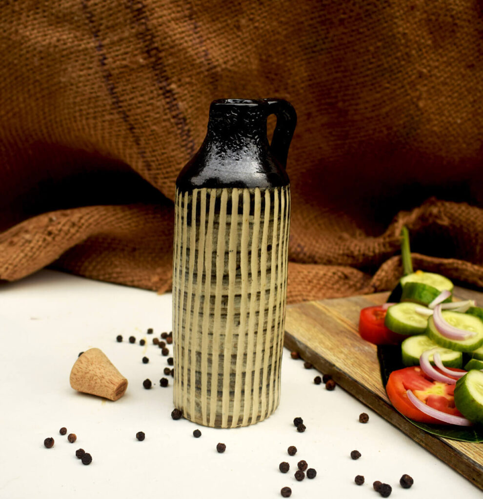 black hand-carved ceramic oil bottle - Cloybotik ceramic studio in jaipur